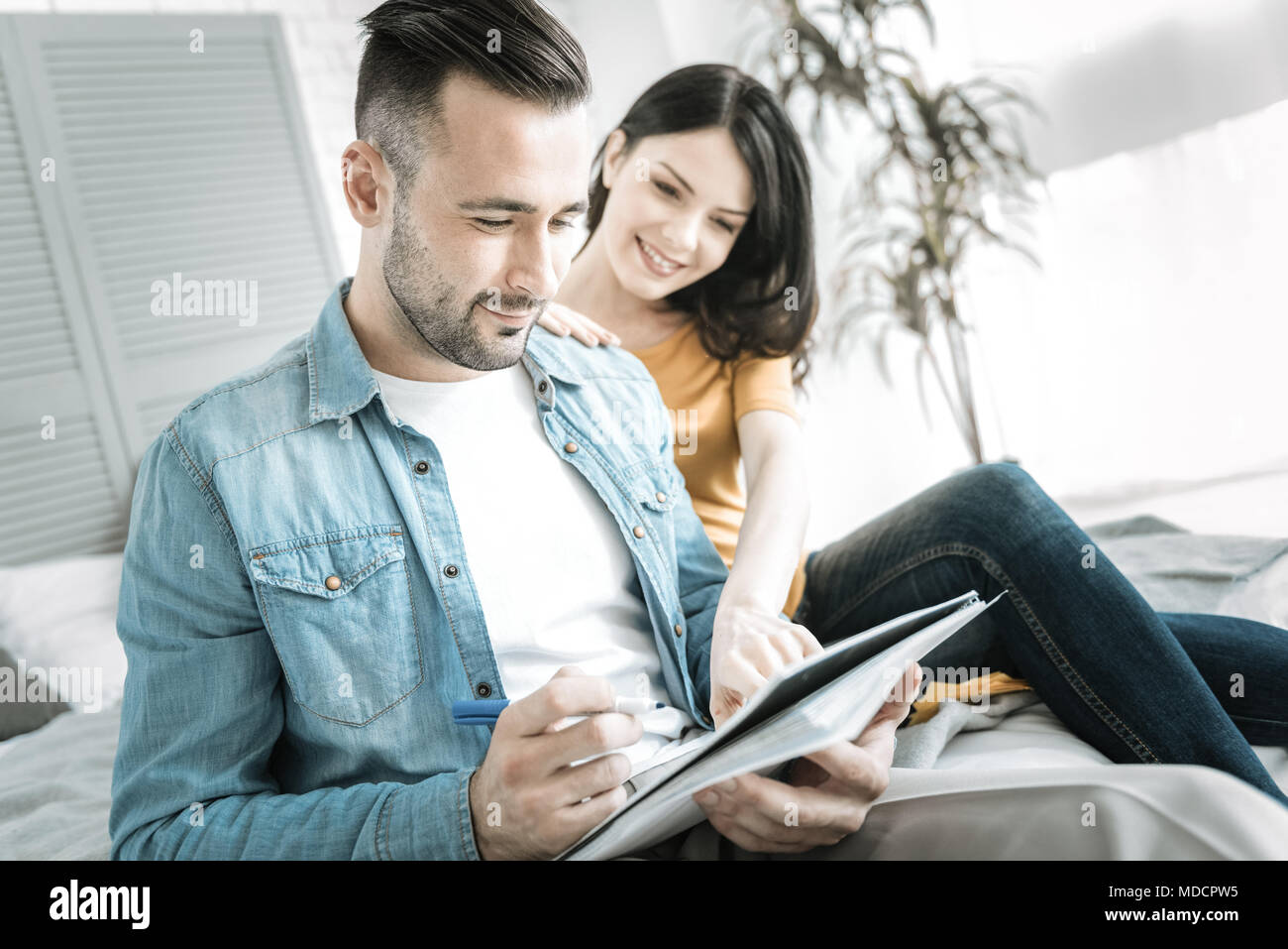 Glad two students checking material Stock Photo - Alamy