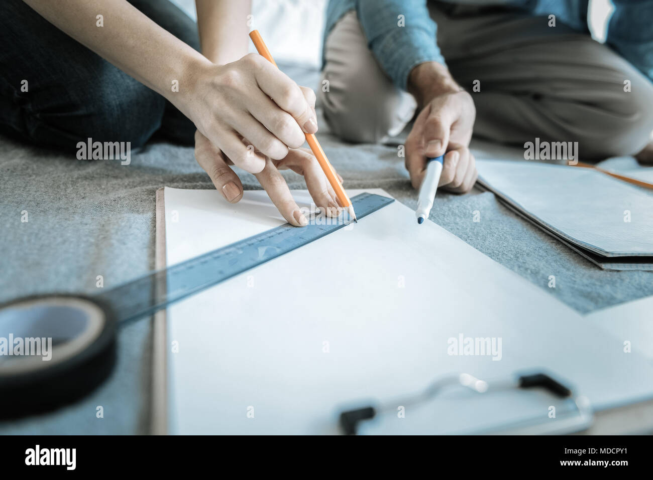 Smooth female hands measuring distance Stock Photo - Alamy