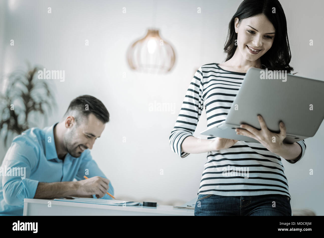 Skillful professional woman reviewing report Stock Photo - Alamy