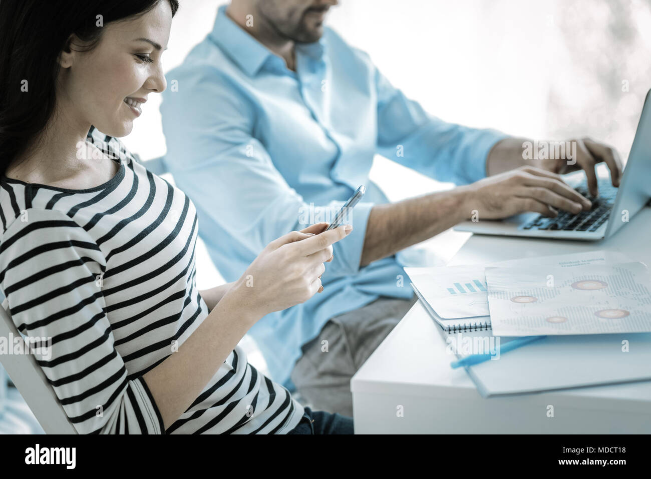Attractive charming woman checking messages Stock Photo - Alamy