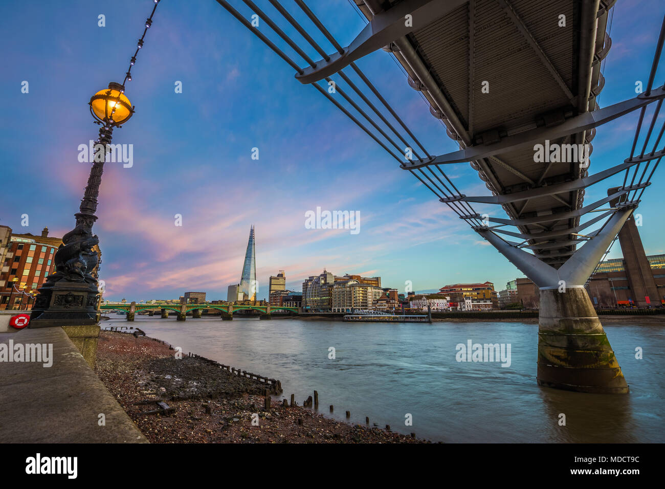 London, England - Beautiful sunset scene at Millennium Bridge with ...