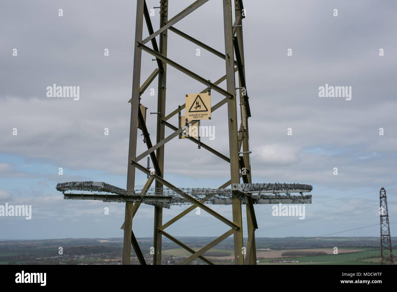 Danger of death sign and barbed wire to prevent climbing up electricity ...