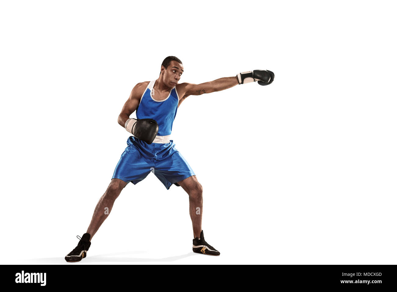 Sporty man during boxing exercise making hit. Photo of boxer on white ...