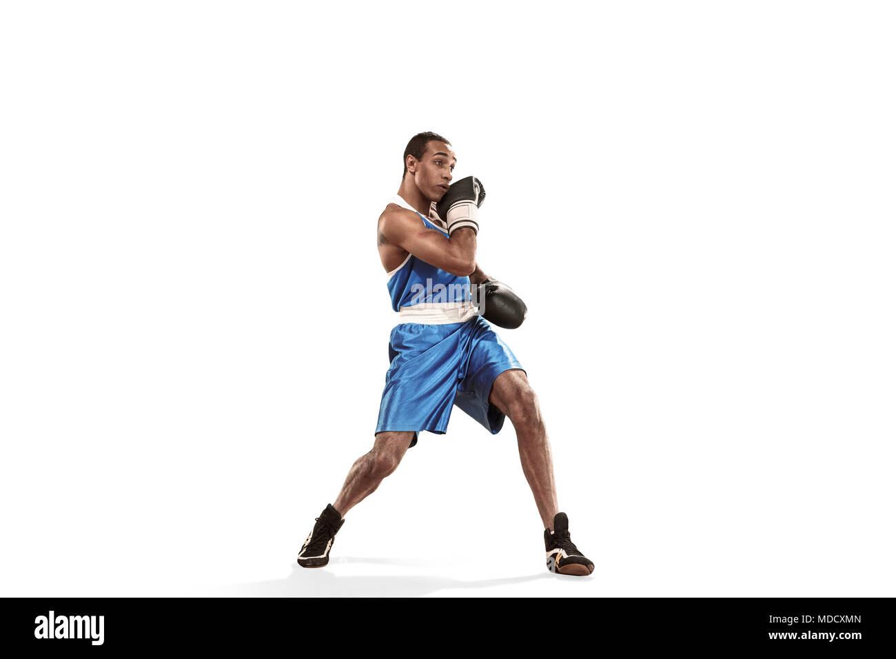 Sporty man during boxing exercise making hit. Photo of boxer on white ...