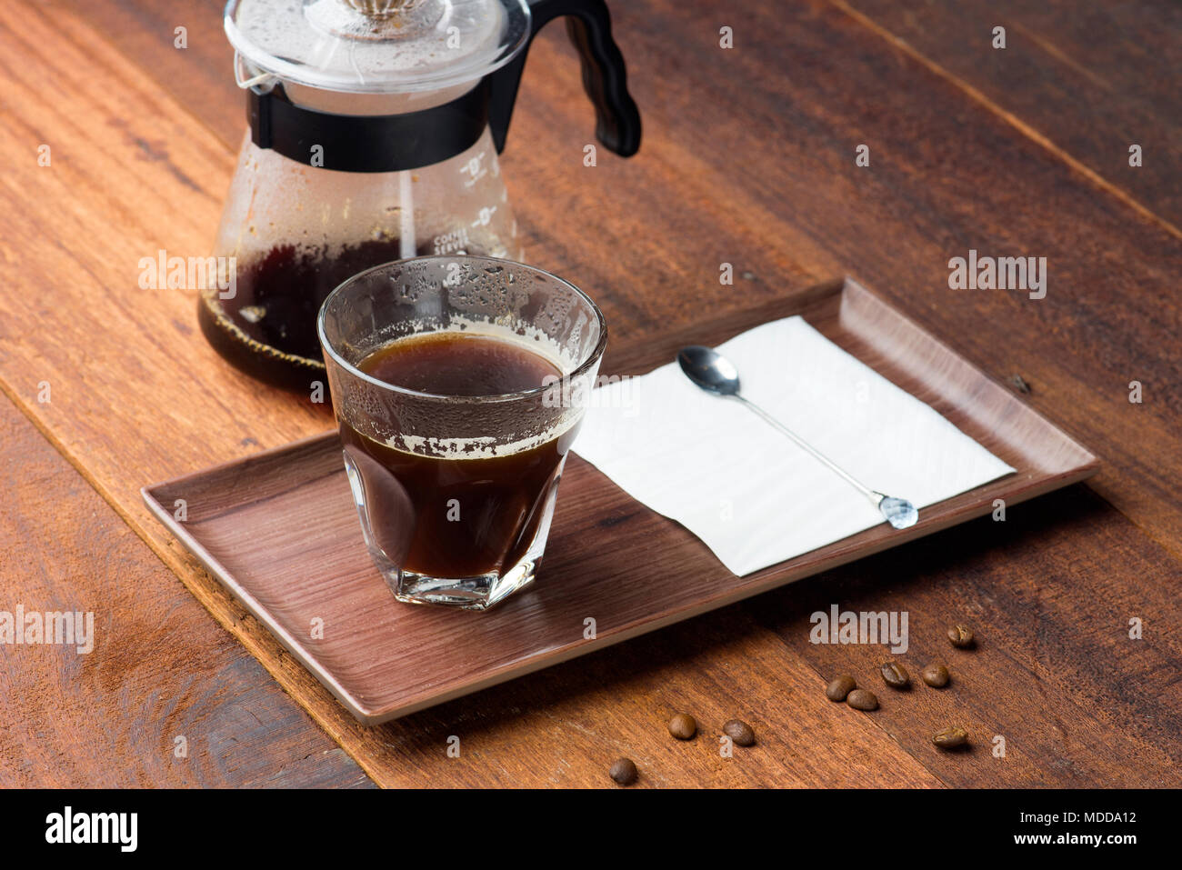coffee dripping on wooden background Stock Photo - Alamy