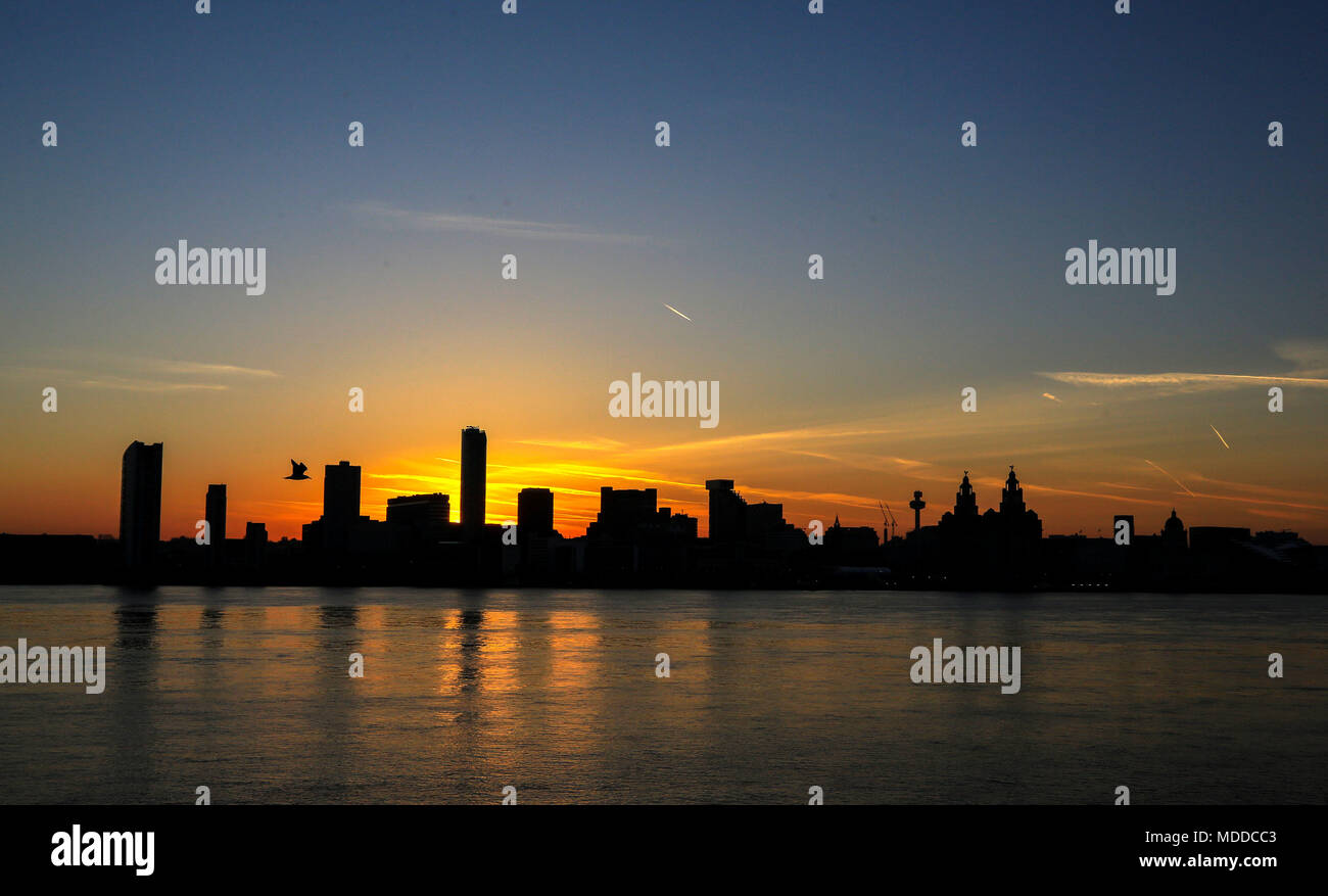 The sun rises behind liverpool skyline on what hi-res stock photography ...