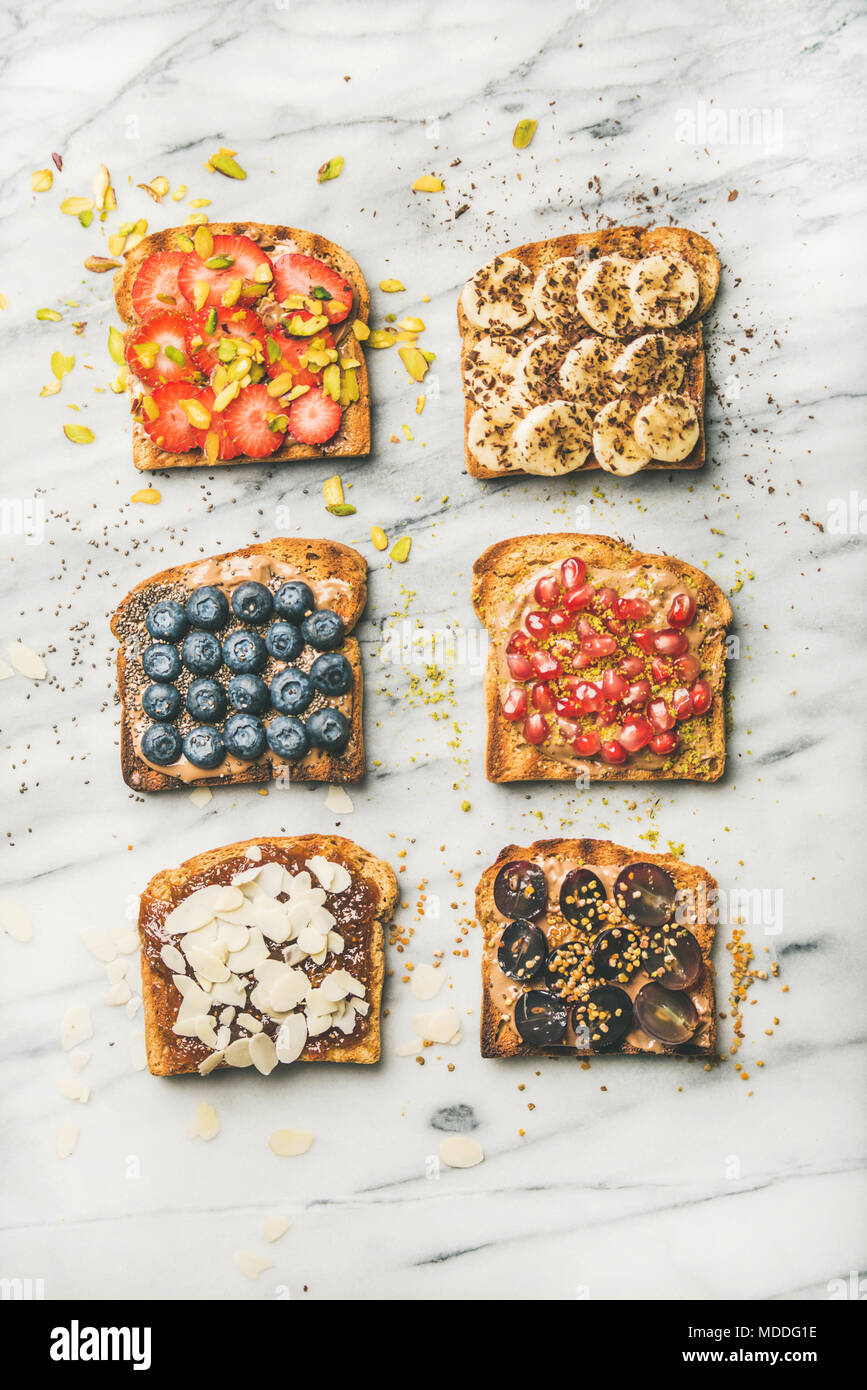 Healthy breakfast or snack. Flat-lay of vegan whole grain toasts with ...