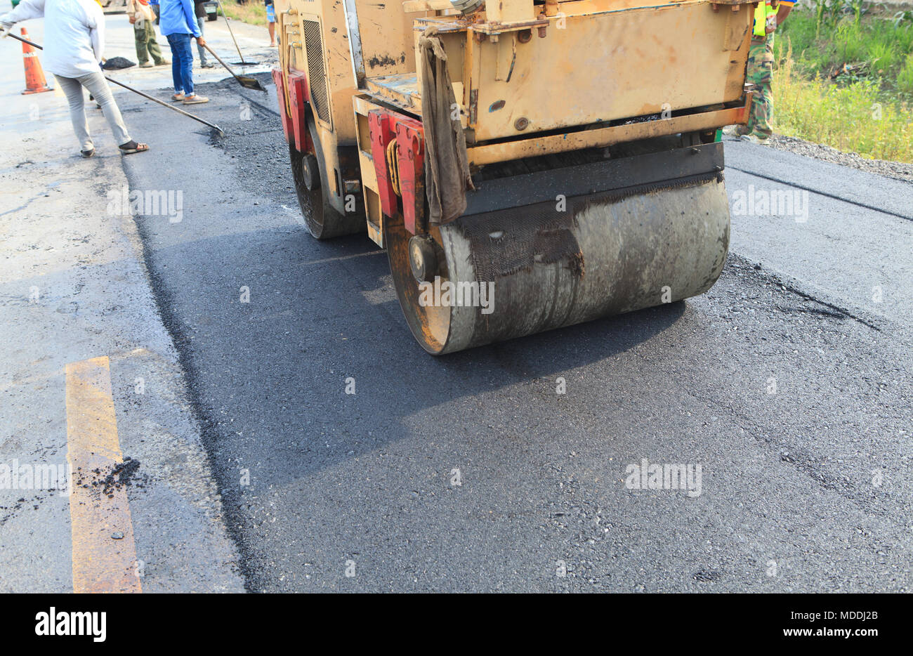 heavy machine working on asphalt Stock Photo - Alamy