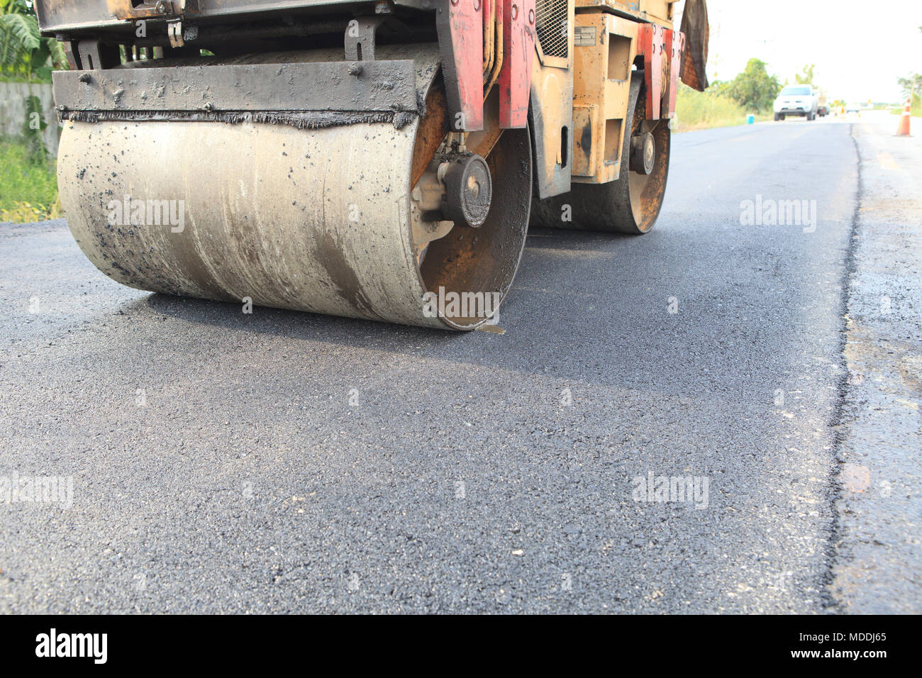 heavy machine working on asphalt Stock Photo - Alamy
