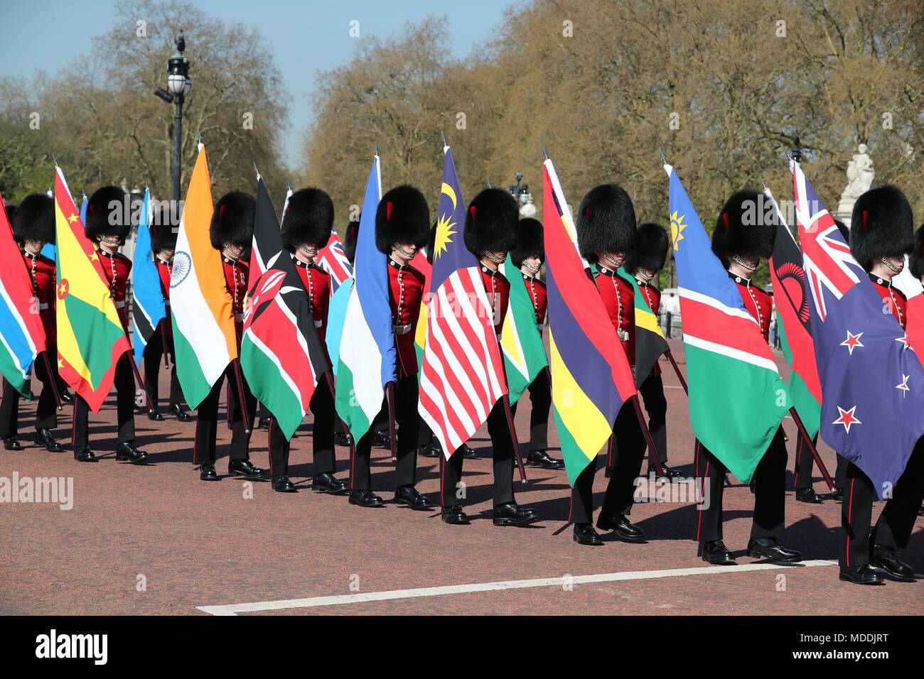Soldiers of the Coldstream Guards carry flags of the 53 Commonwealth ...