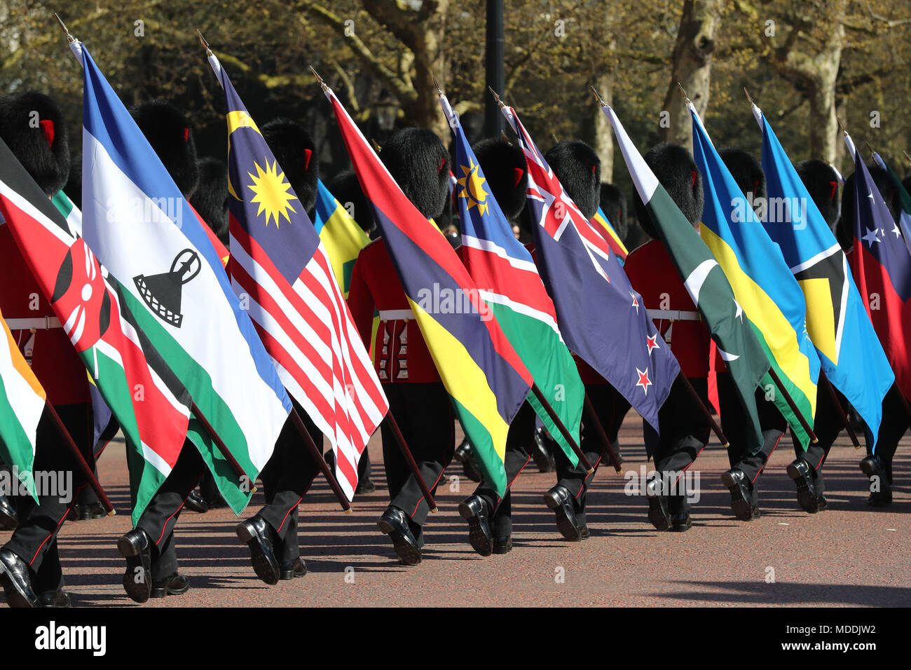 Soldiers of the Coldstream Guards carry flags of the 53 Commonwealth ...