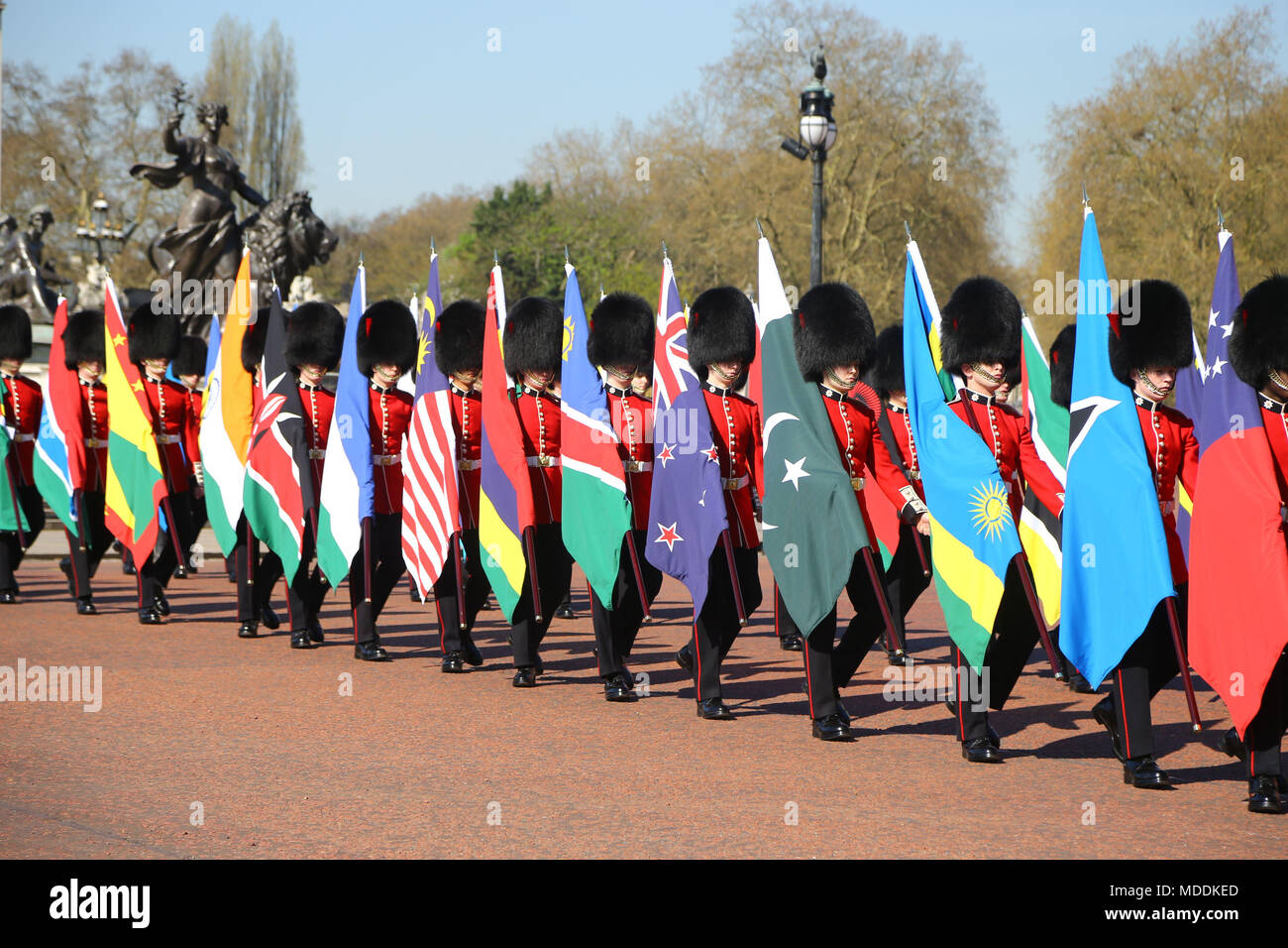 Soldiers of the Coldstream Guards carry flags of the 53 Commonwealth ...