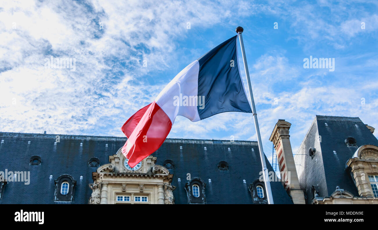 french flags flying in front of a building in France Stock Photo - Alamy