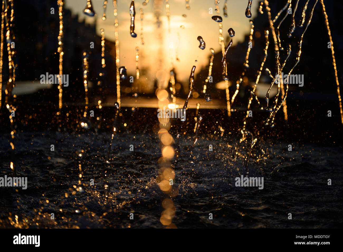 Water blurred splash in sunset light background Stock Photo - Alamy