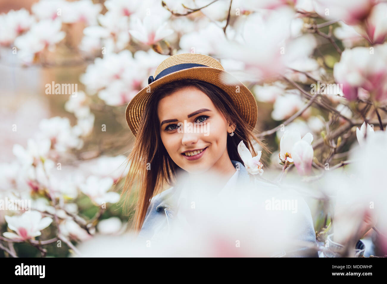 Outdoor portrait of young beautiful happy smiling lady posing near ...