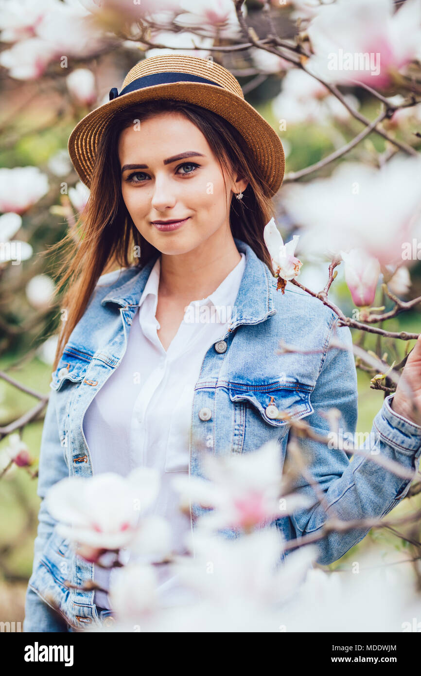 Outdoor portrait of young beautiful happy smiling lady posing near ...