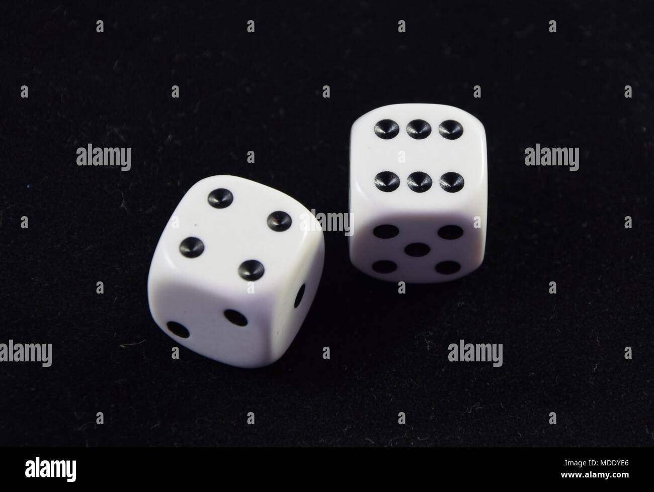 A pair white of dice showing Six and Four Stock Photo - Alamy