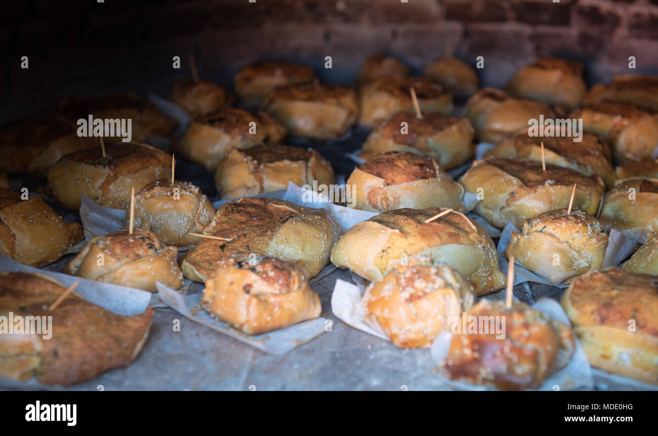 Traditional Cypriot easter cheese pastries cooked on a clay oven. The ...