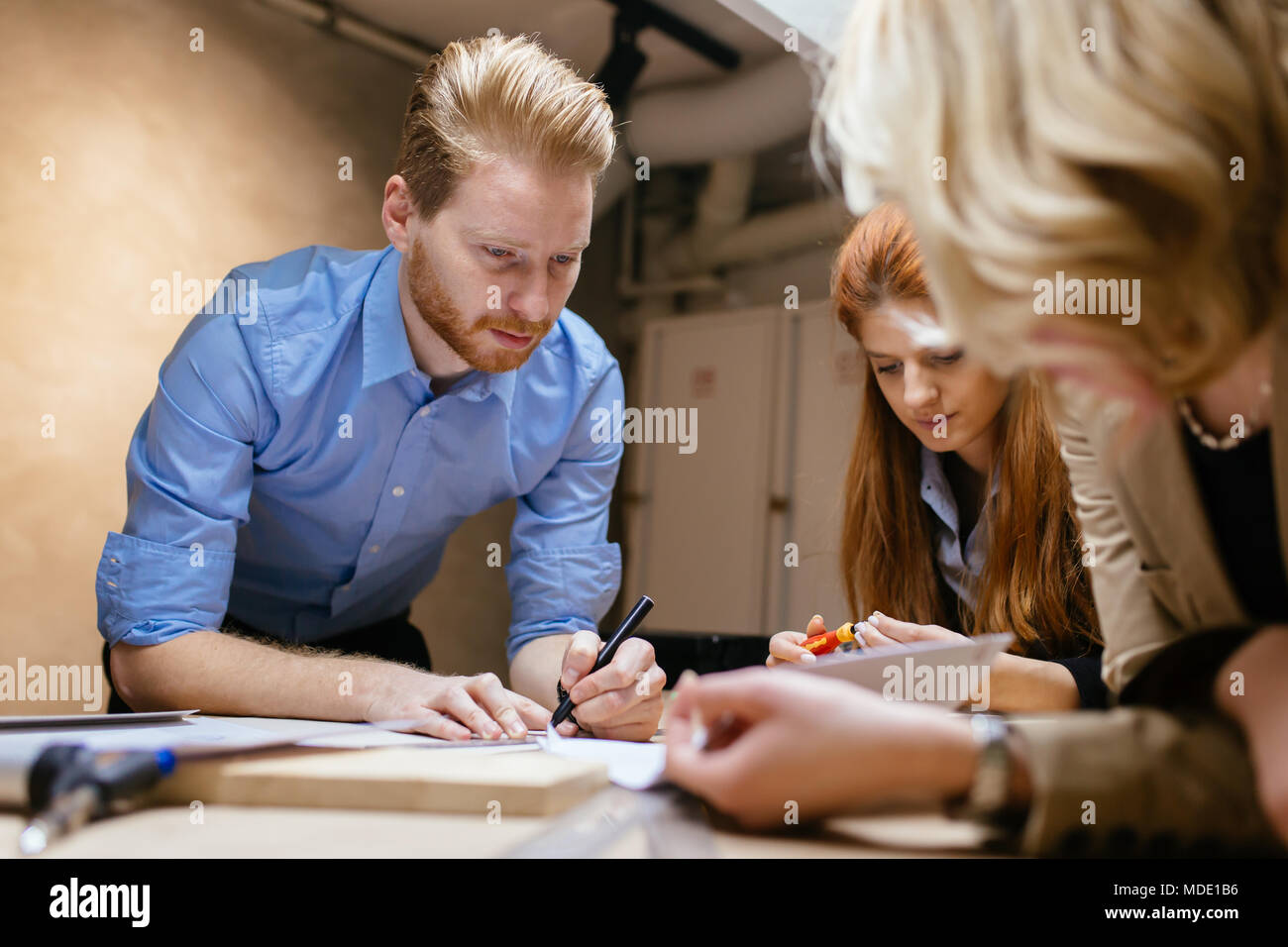 Creative workers designing and planing Stock Photo - Alamy