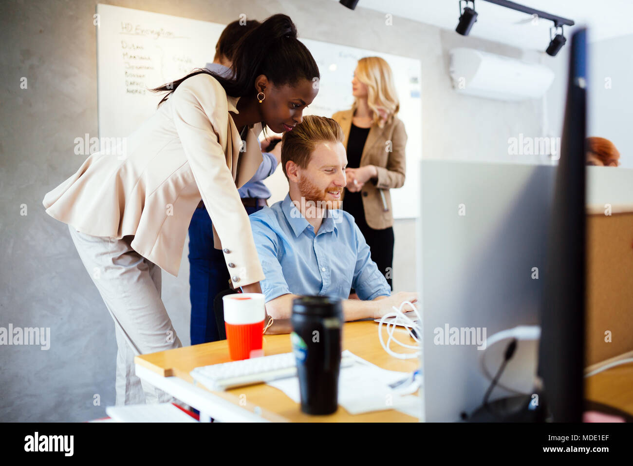 Collaborating office professionals using hi-res stock photography and ...