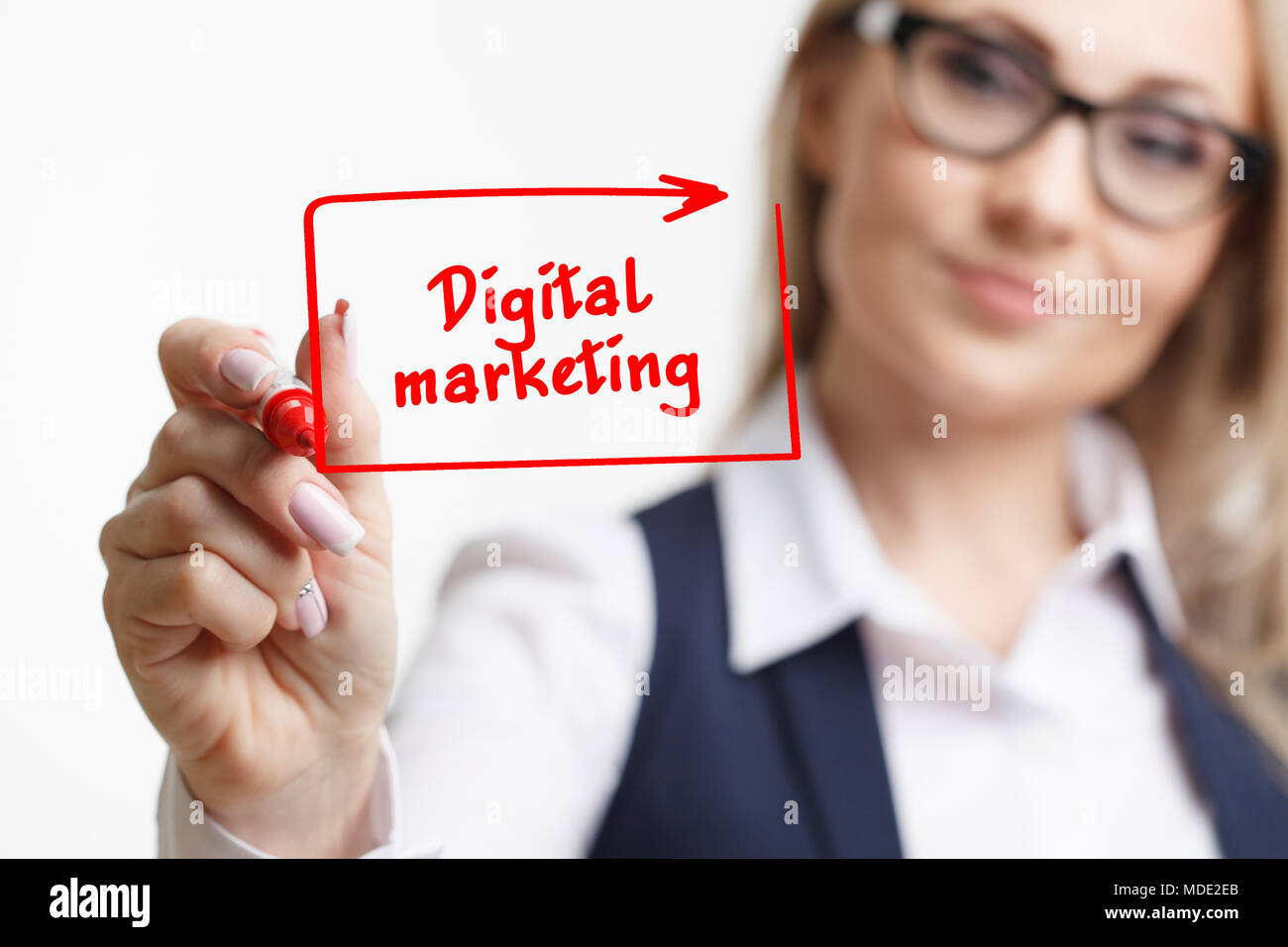 Business woman writing something with a marker or pen.DIgital marketing ...