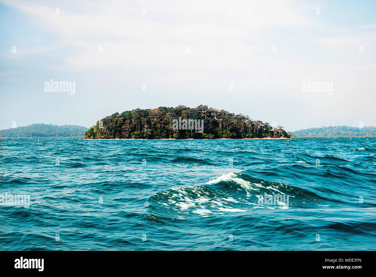 a small island in the sea. Strong waves on the water Stock Photo - Alamy