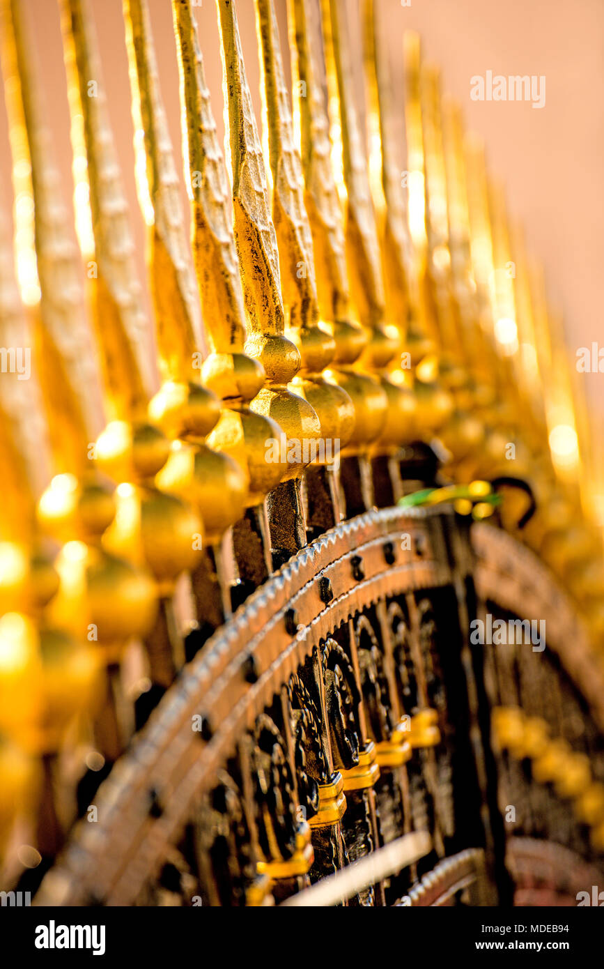golden fence made of wrought iron Stock Photo - Alamy