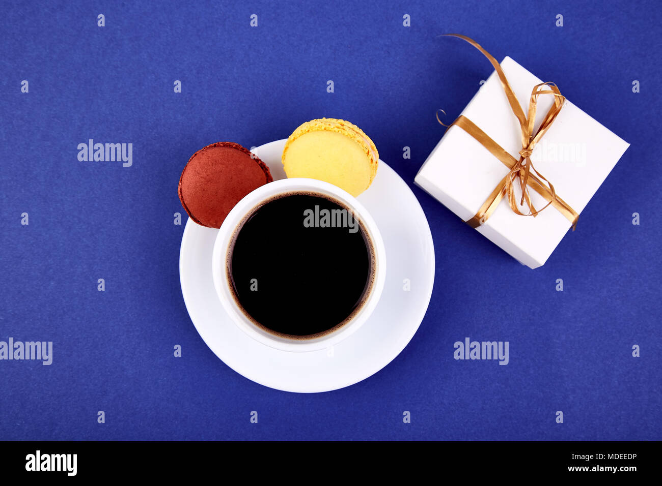 Sweet Dessert Macaron or macaroon with coffee, colorful almond cookies ...