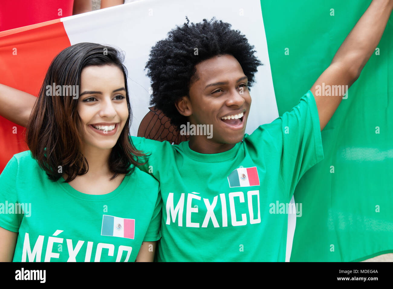 Two cheering soccer fans from Mexico at stadium with mexican flag Stock ...