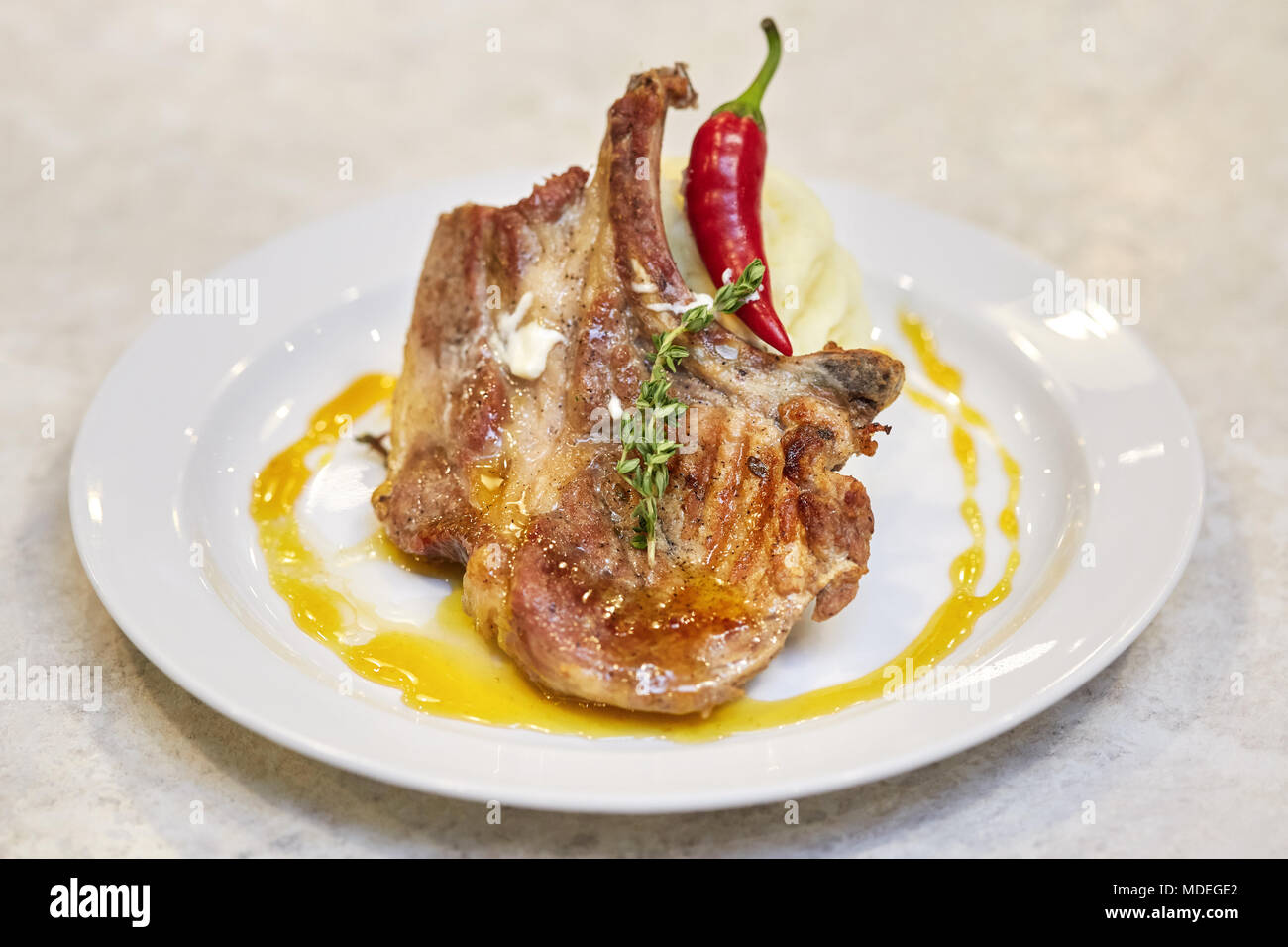 Roasted fresh pork meat steak with orange sauce on plate, closeup Stock ...