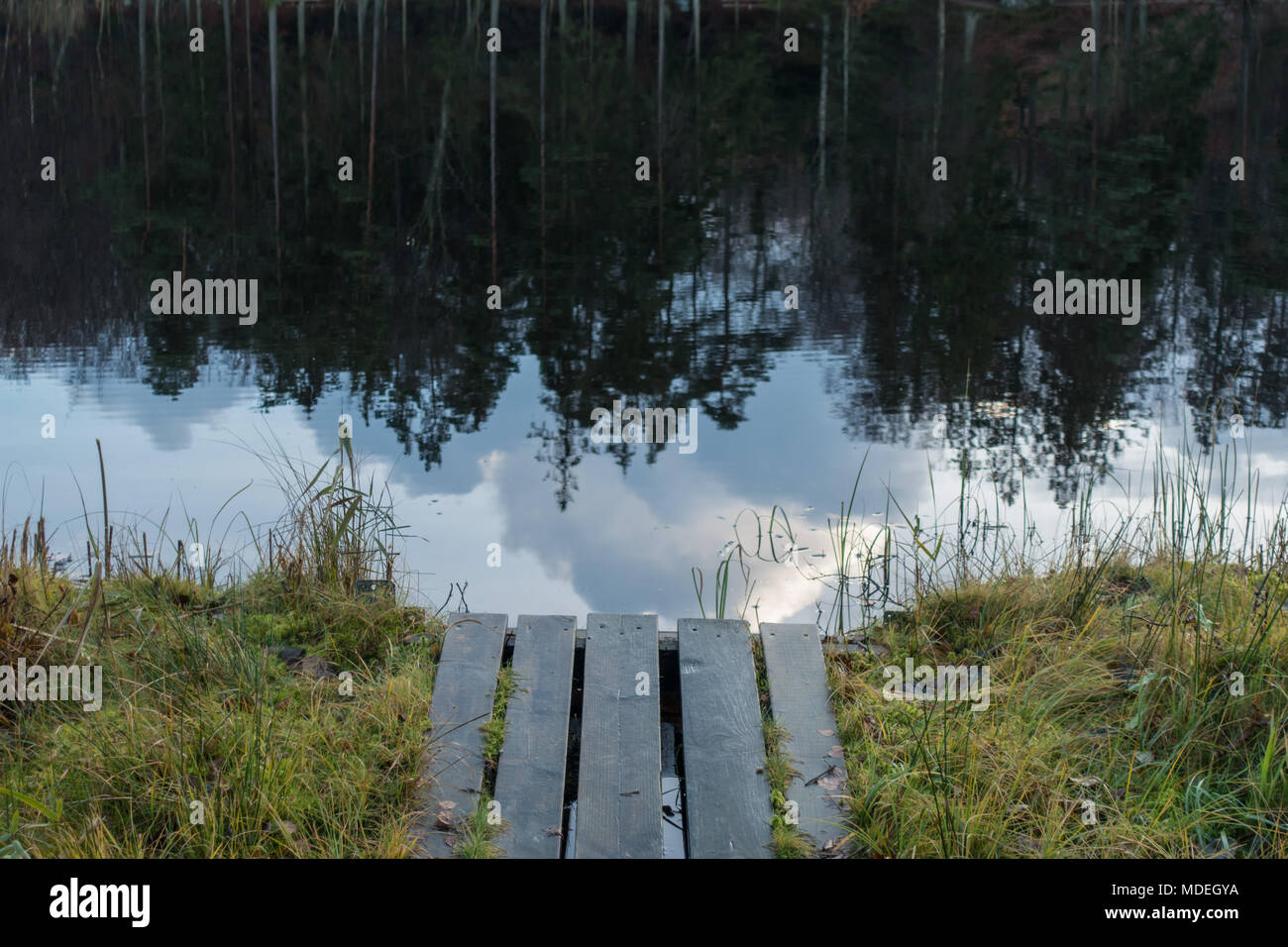Cloud reflections on the surface of the lake Stock Photo - Alamy