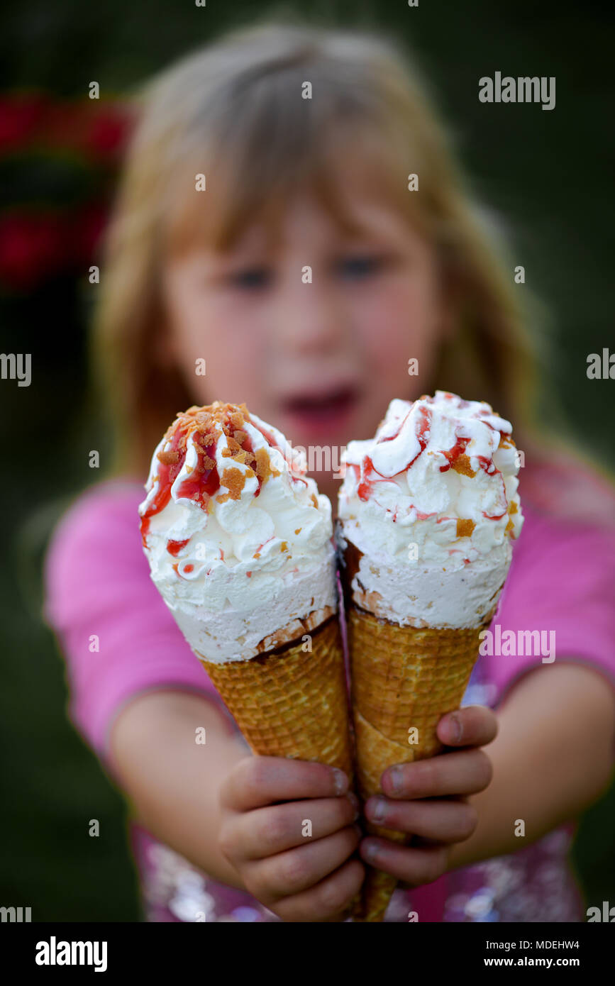 Womans Hands Holding Melting Ice Cream Waffle Cone In Hands On Summer