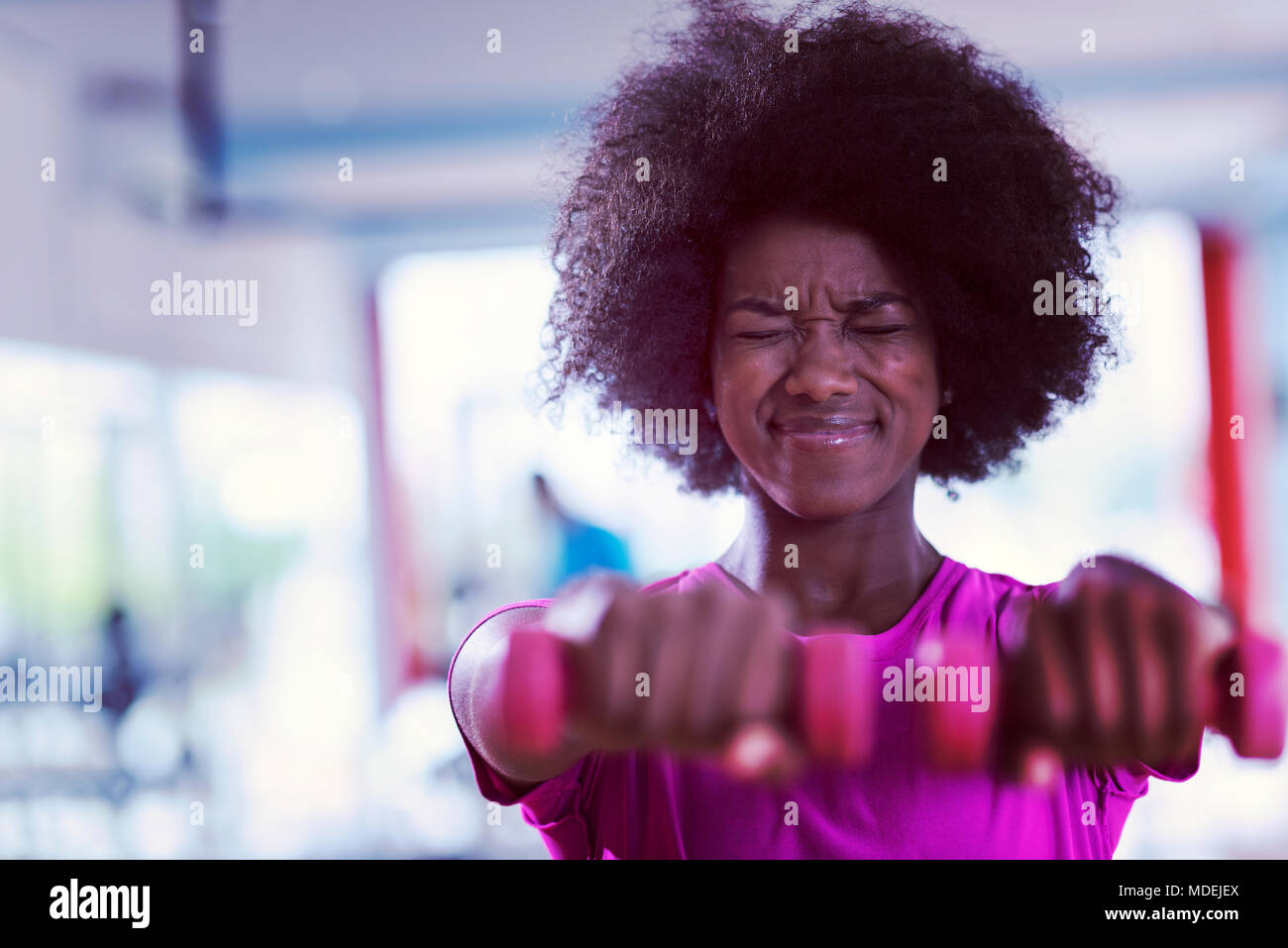 happy healthy african american woman working out in a crossfit gym on ...