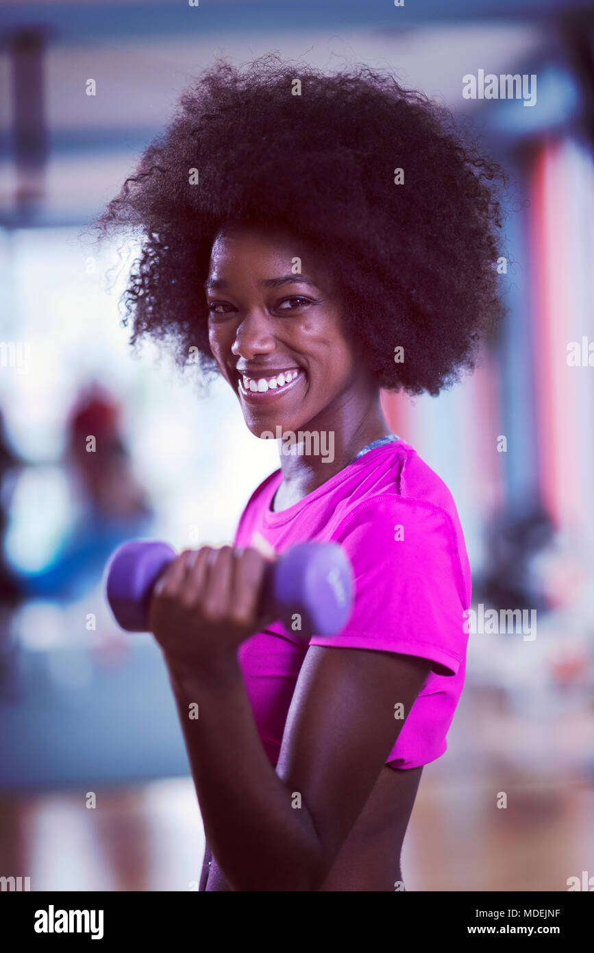 happy healthy african american woman working out in a crossfit gym on ...