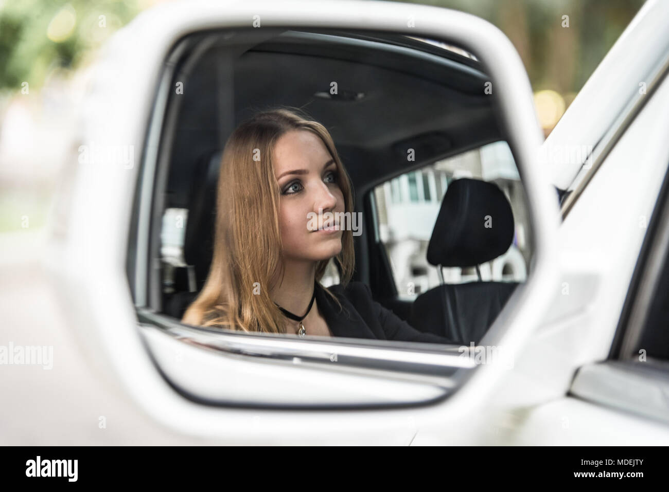 Reflection woman in car rear hi-res stock photography and images - Alamy