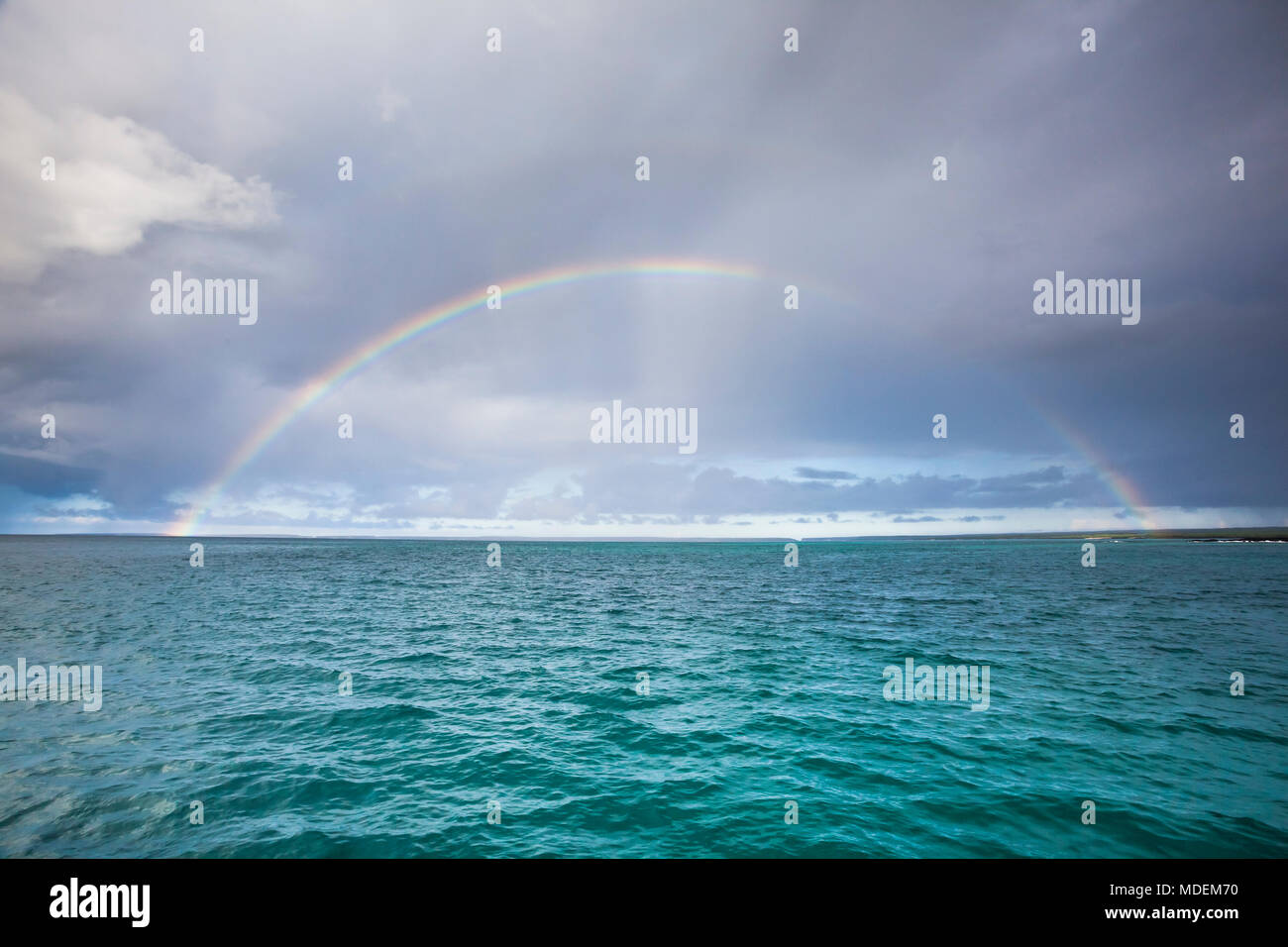 Full rainbow over the sea off the coast of the Galapagos Islands Stock ...