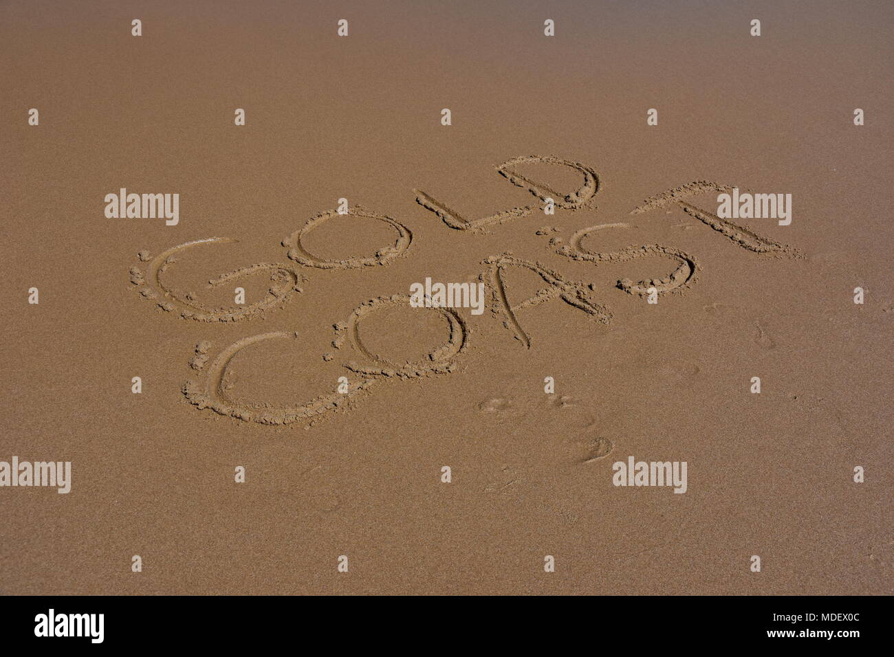 Gold Coast written on sand. Gold Coast lettering on the beach. Gold ...