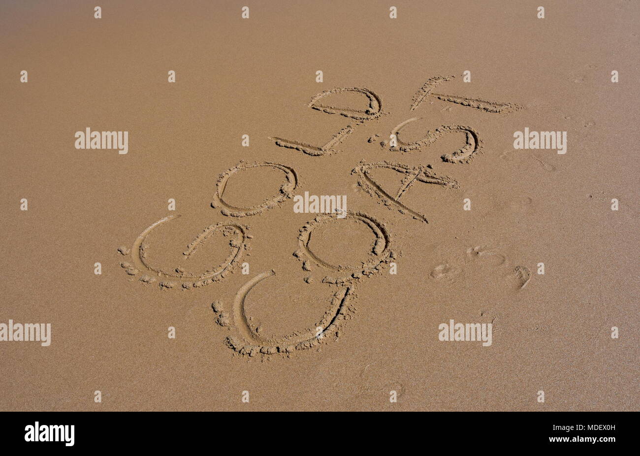 Gold Coast written on sand. Gold Coast lettering on the beach. Gold ...