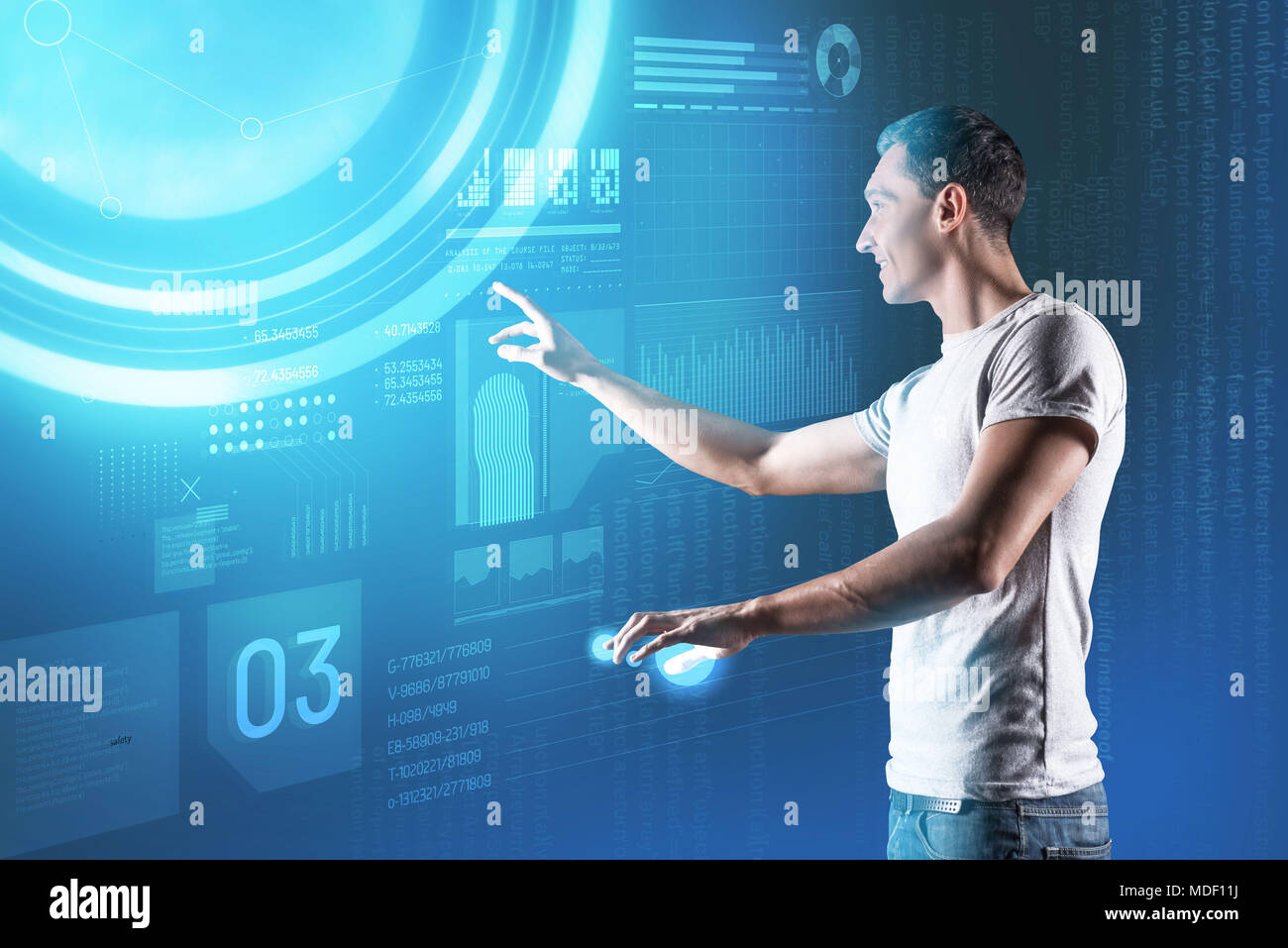 Data scientist smiling while touching a transparent screen Stock Photo ...