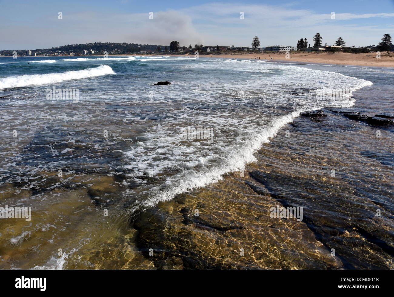 Water flows into the sea at the sandy beach hi-res stock photography ...