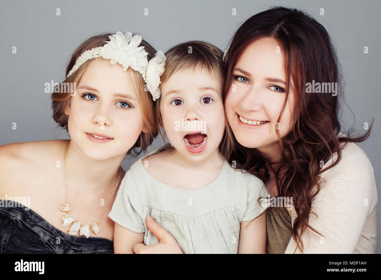 Three girls embracing hi-res stock photography and images - Alamy