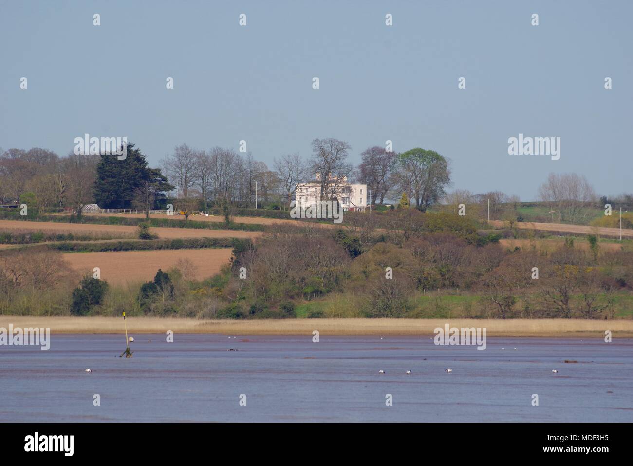 Pink Manor House amid Patchwork Farming Landscape beyond the Mudflats ...