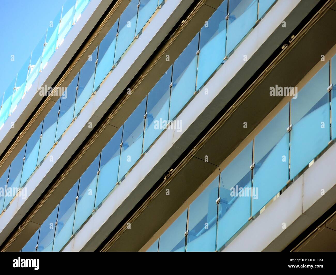 Light blue glass panes on balconies. Pattern. Minimalism Stock Photo ...