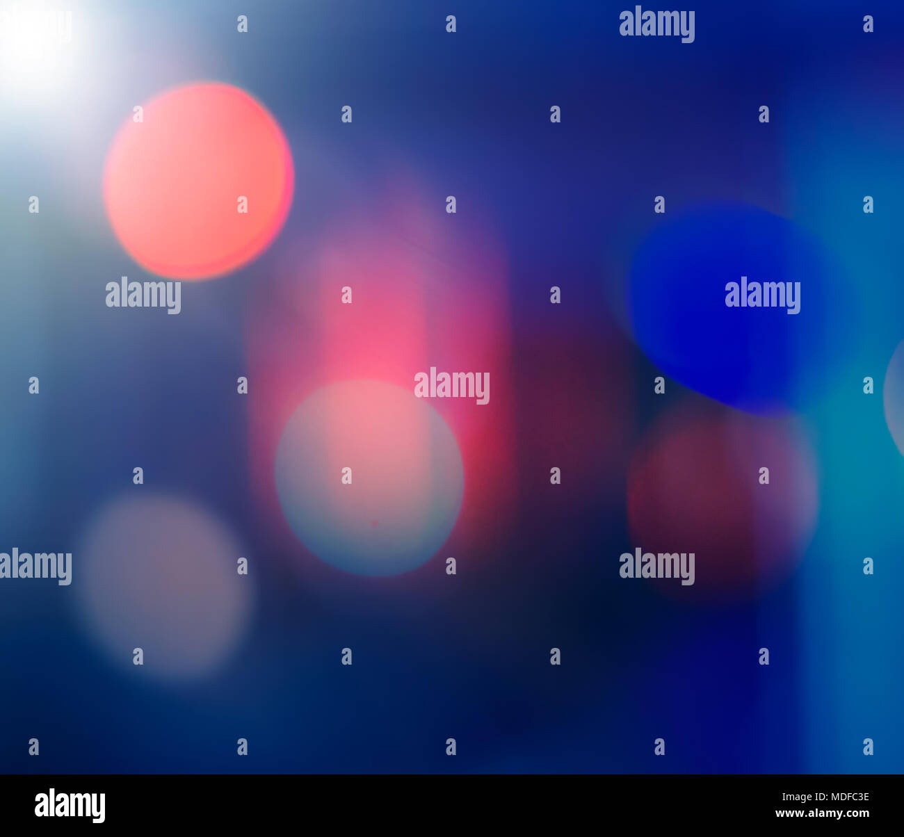 Abstract blurred background. Multicolored light spots on a dark ...