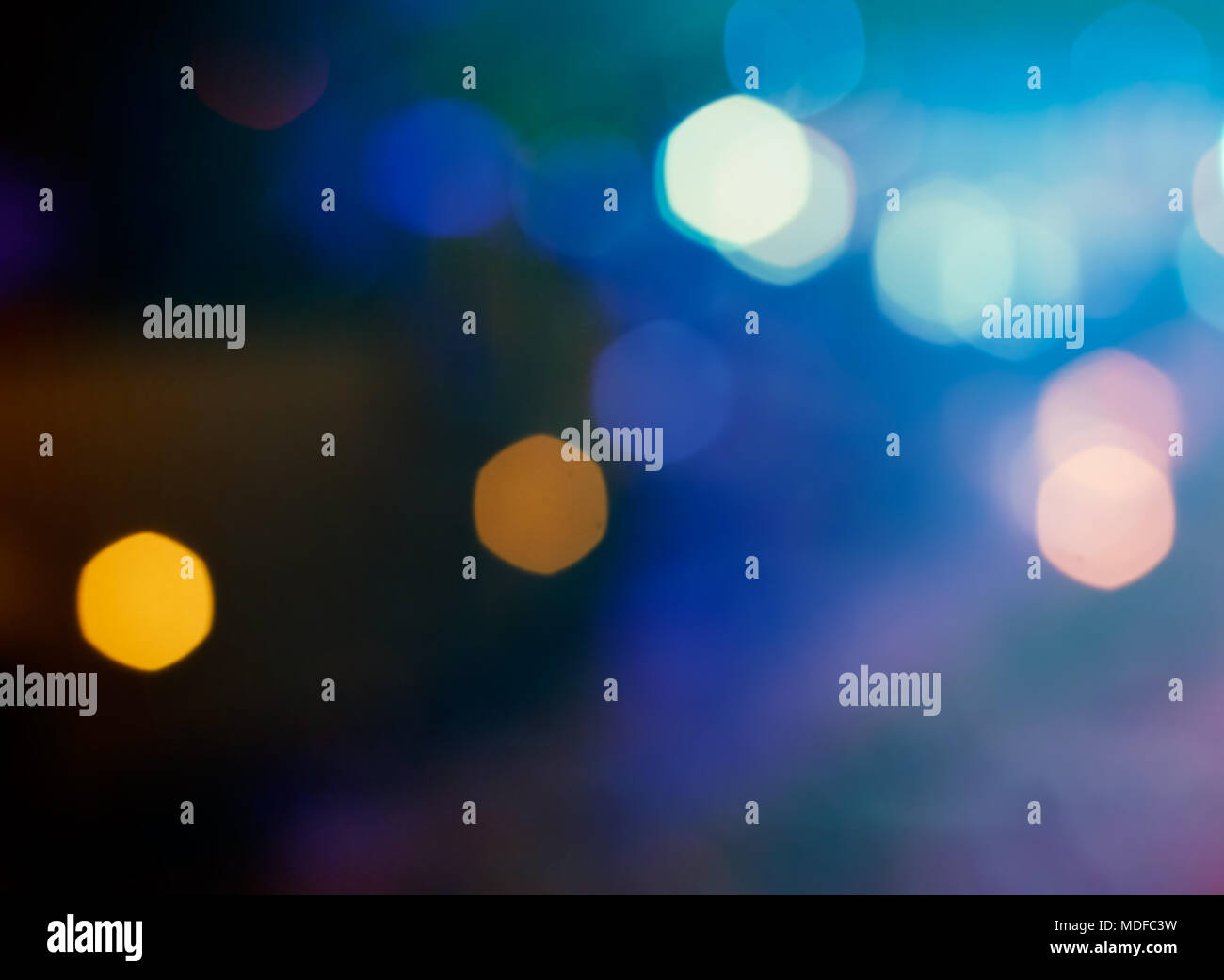 Abstract blurred background. Multicolored light spots on a dark ...