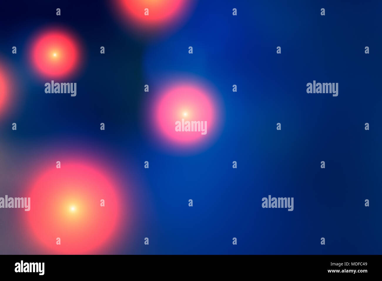 Abstract blurred background. Multicolored light spots on a dark ...