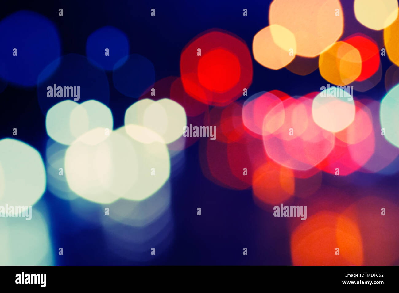 Abstract blurred background. Multicolored light spots on a dark ...