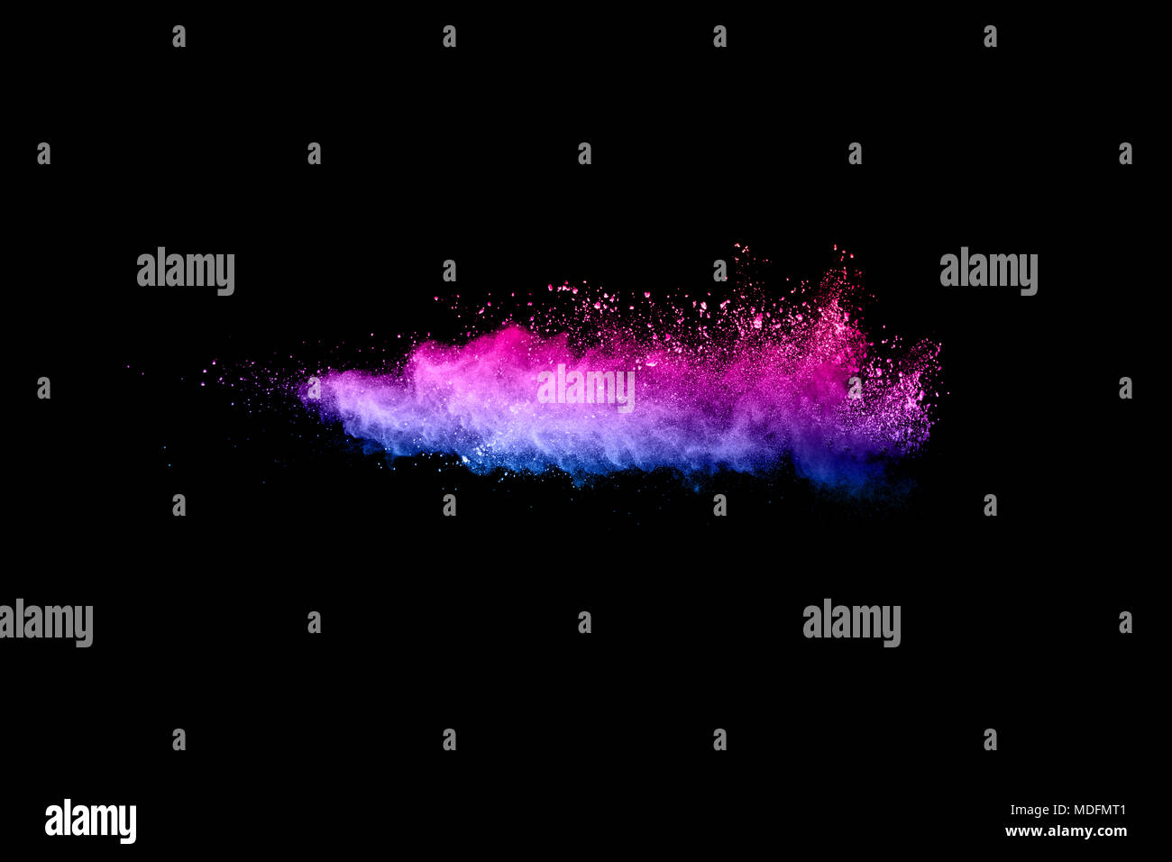 Multi color powder explosion isolated on black background. Colored dust ...