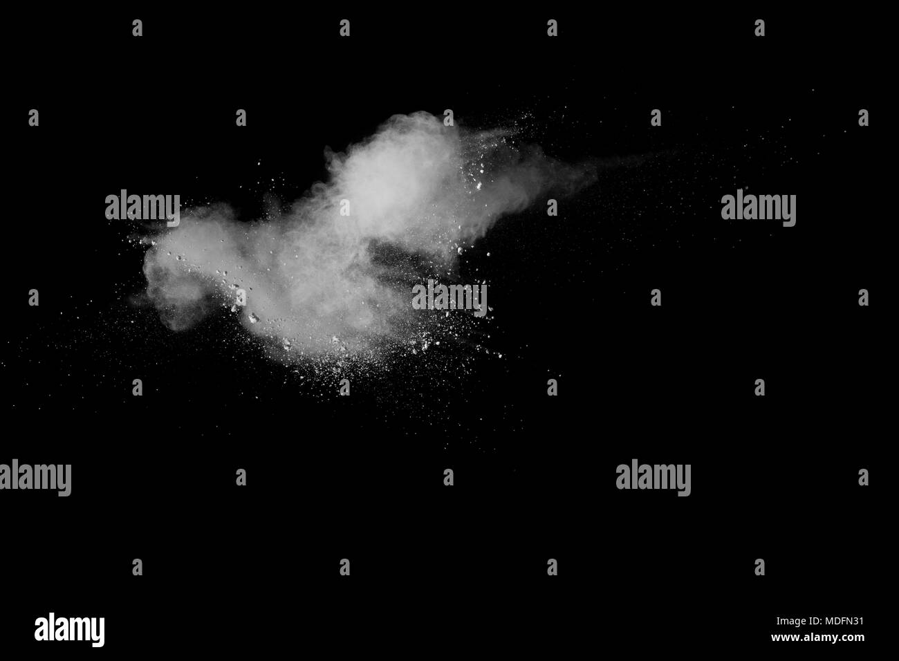 Bizarre forms of white powder explosion cloud against dark background ...