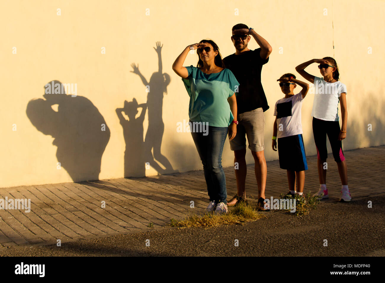 Children making shadows on wall hi-res stock photography and images - Alamy